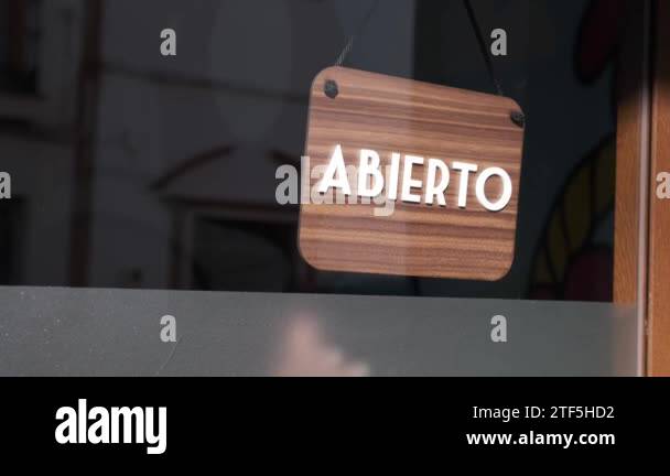 Small business closing up. Turning the sign from open to closed in ...