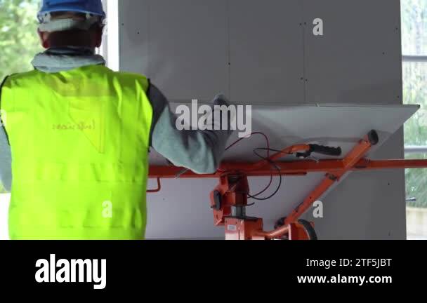 Hard male work on construction site. Two professional workers in ...