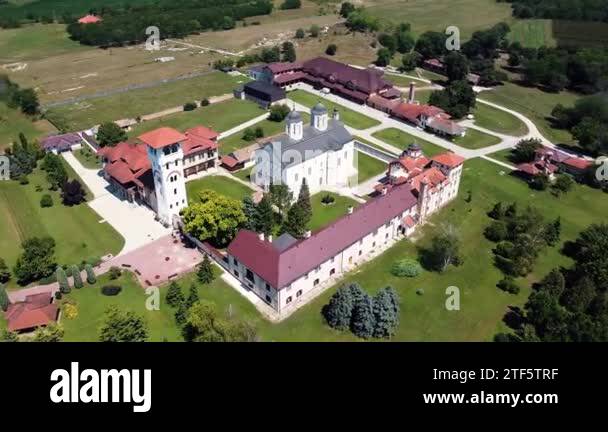 large church estate with a large meadow and several old churches with a ...