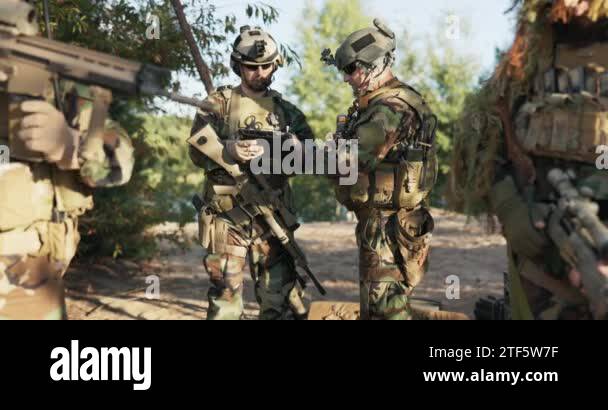 The military prepares for a field exercise, men dressed in moro ...