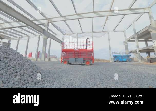 Mobile folding lifting platform at the construction site. Large folding ...