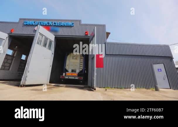 Tank and truck cleaning. A tanker truck drives into a tank cleaning ...