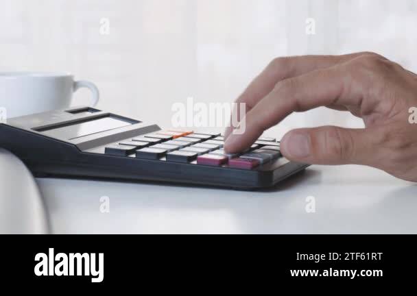 4K man hand using calculator on office desk. Male hand press calculator ...