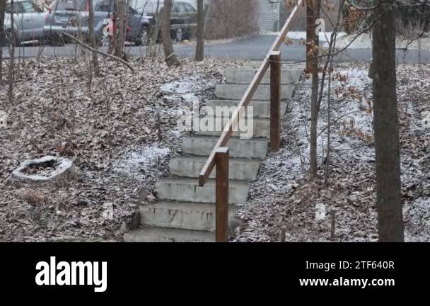 Snow falls slowly on outdoor steps in front yard Stock Video Footage ...