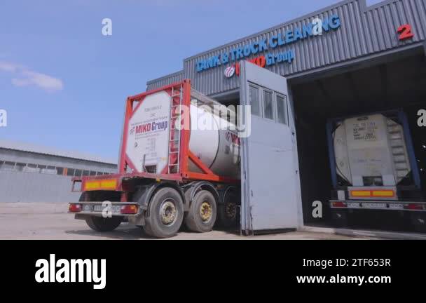 Tank and truck cleaning. A tanker truck drives into a tank cleaning ...