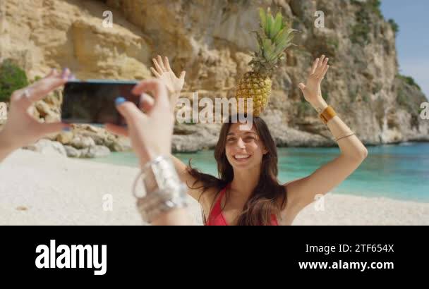 Fun, playful and goofy friends on beach bonding, having fun and ...