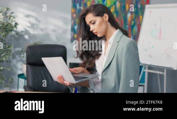 Focused assistant of the boss, secretary, manager is standing at the ...