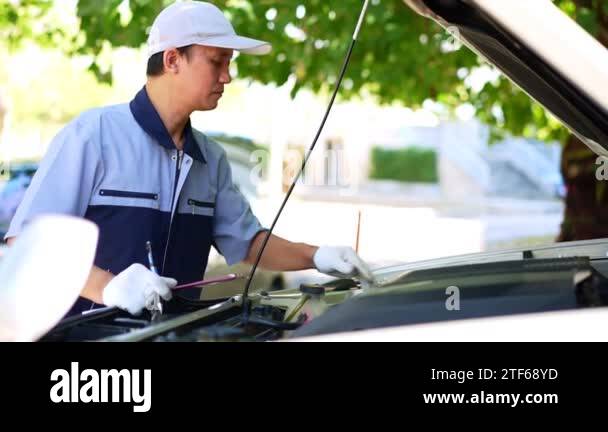 Auto mechanic checking and maintenance to customer the engine a vehicle car hood and masters ...