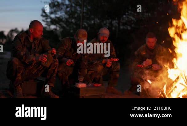 The military set up camp at night in the training areas, lit a campfire ...