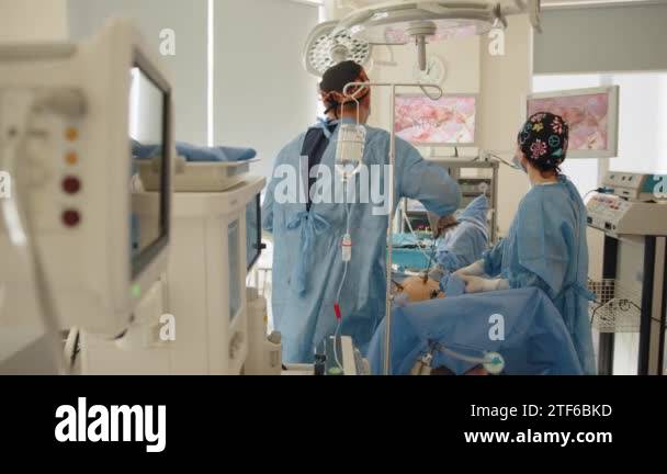 Team surgeon at work on laparoscopy operating in hospital. Surgeon ...