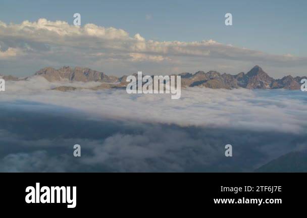 8K 7680X4320.Layers above and below the cloud layer.Rocky peaks of ...