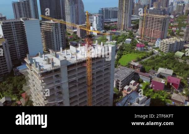 Construction of new multi-storey buildings. Construction crane on ...