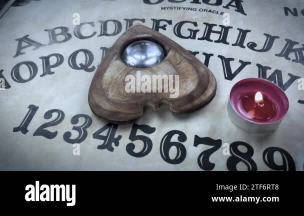 Ouija board glass Stock Videos & Footage - HD and 4K Video Clips - Alamy