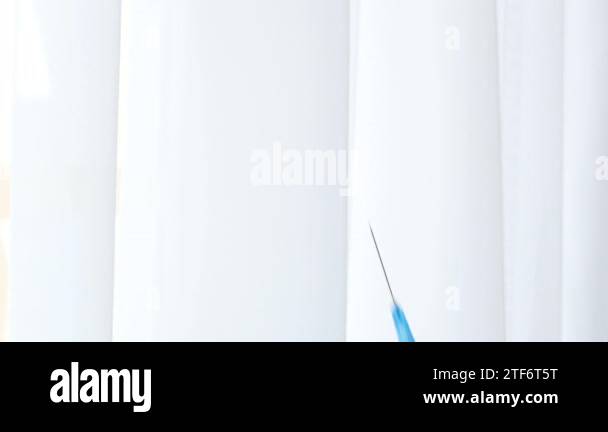 Close Up of injection liquid being in syringe. Medication drug needle ...