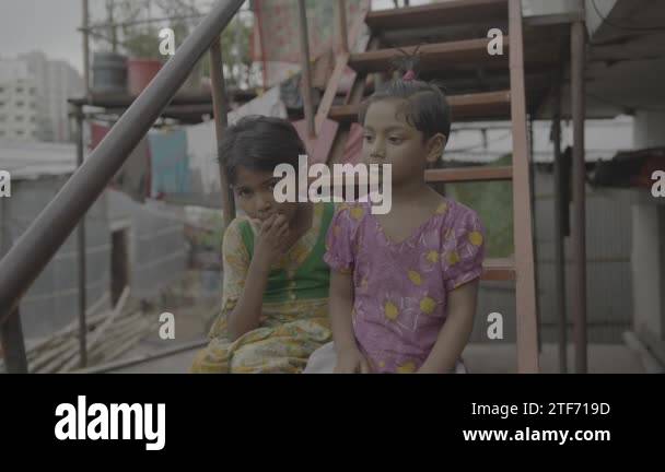 Poor Children from a slam of Bangladesh gathering in a staircase. 10 bit 422 log footage- Slow ...