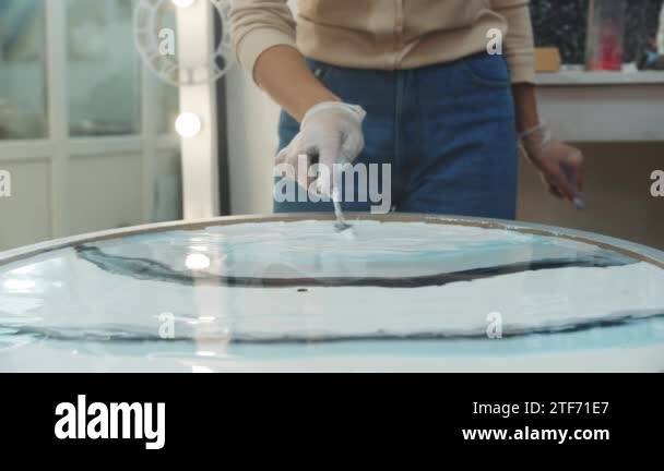 Flattening The Surface Of Epoxy Resin Art Object Using A Spatula Art