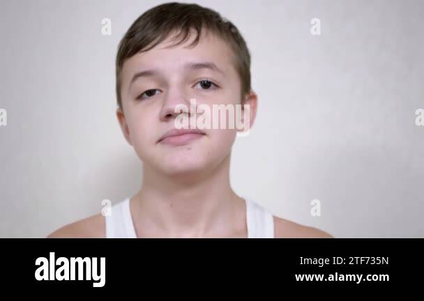 Angry Boy Propping his Chin with his Fist Looking at the Camera. 4K ...