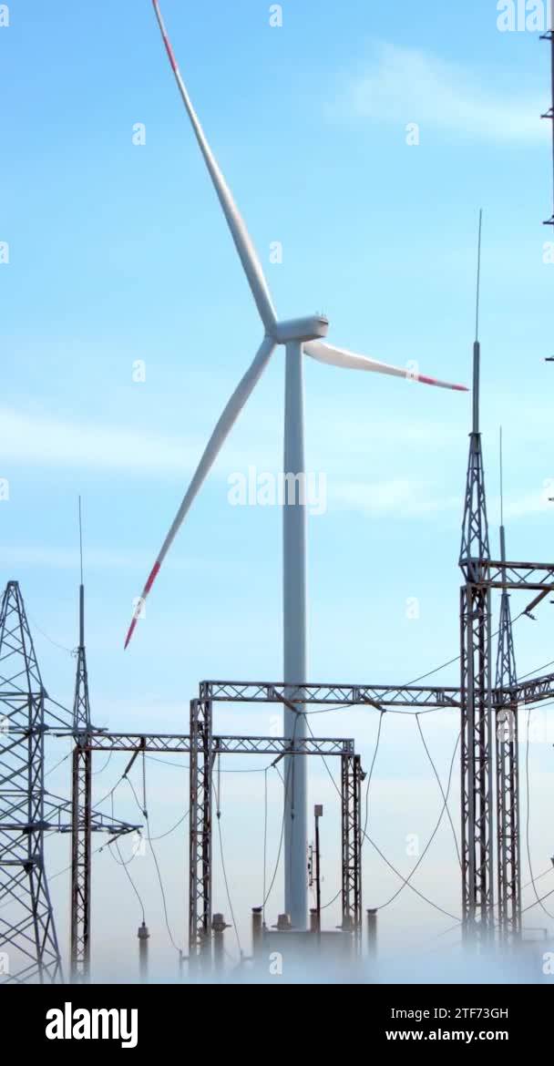 Wind turbine and electric power transmission at station. Powerful ...