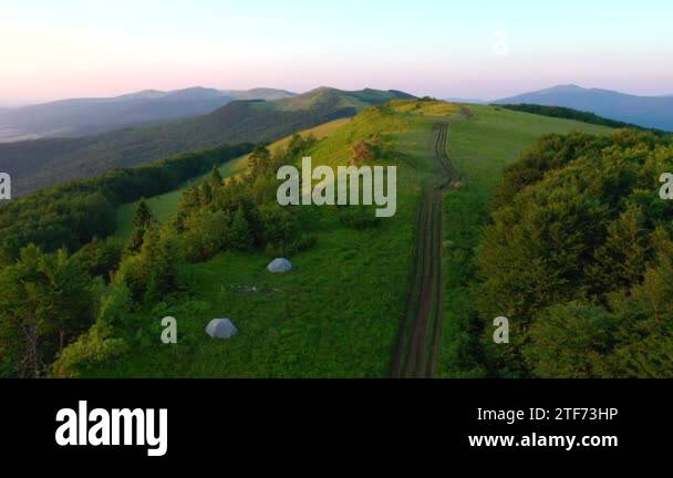 Tourist camp with tents on top of the ridge from a bird's eye view ...