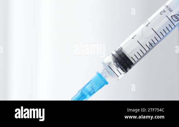Close Up of injection liquid being in syringe. Medication drug needle ...