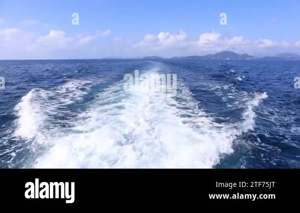 Sea water with foamy surface.. Boat travel. Cruise ship trail. Blue ...
