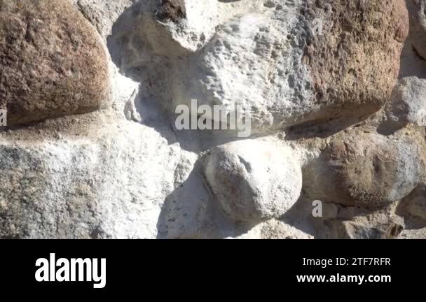 An efflorescence effect sample - salt deposits on stone masonry. A ...