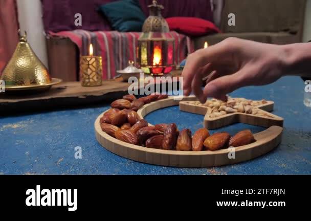 Fasting during Ramadan. Organic dates palm fruit serving during Iftar ...