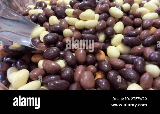 Nuts Different sweets on the counter are laid out all the colors of the ...