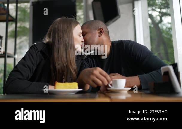 Happy couple kissing dating at coffee shop. Diversity concept of two ...