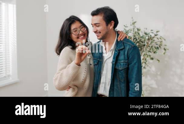 Young couple in love renting buying their first apartment together ...