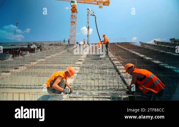 Building construction. Working process at a construction site. Builders ...