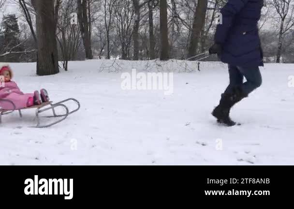 Girl pull sledge Stock Videos & Footage - HD and 4K Video Clips - Alamy