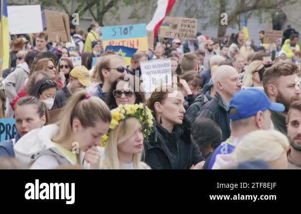 Crowd people with yellow blue Ukrainian flags and STOP WAR signs, San ...