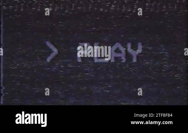 Old damaged VHS tape playing with PLAY text message on screen, retro technology background with ...
