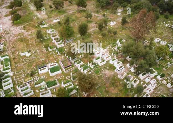 Cemetery with old tombstones and grave headstones. Graveyard from birds ...