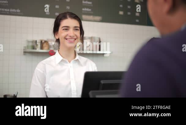 Woman coffee shop employee barista working at cafe. Smiling female ...