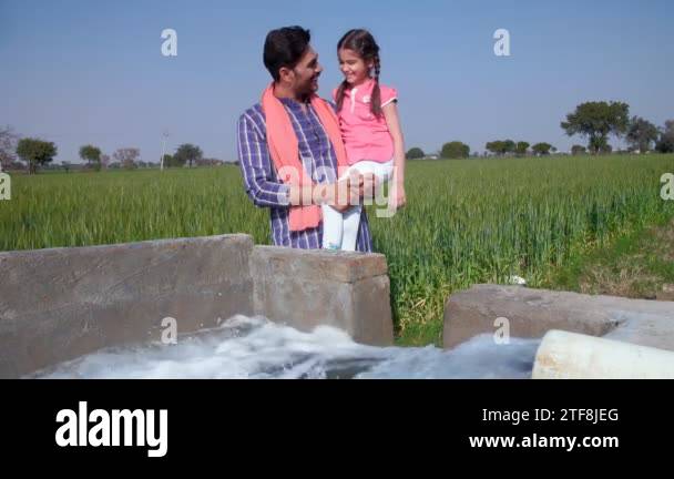 An adorable schoolgirl from an Indian village with her father - father ...