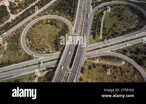 Aerial view of highway junctions with roundabout. Bridge roads shape ...