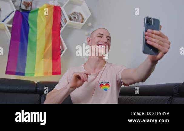 Queer non-binary bald influencer waves to his followers on social media ...