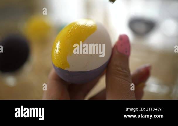 8K 7680x4320.Woman painting easter eggs.Cultural symbol of easter ...