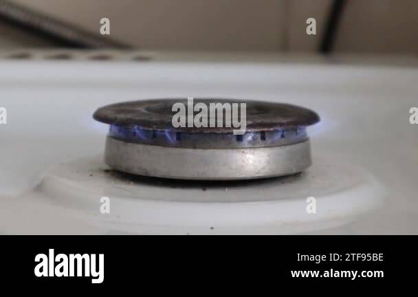 Gas burner on a kitchen stove for cooking with a burning propane fire ...