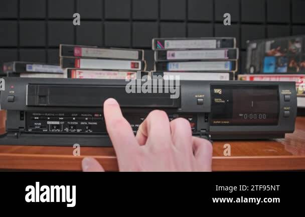 Insert VHS Cassette into VCR and Push Play Button Stock Video Footage ...