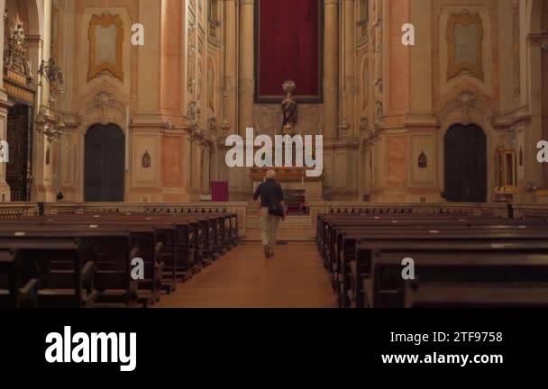 Elderly man walk inside church, rear view. Catholic Church inside ...