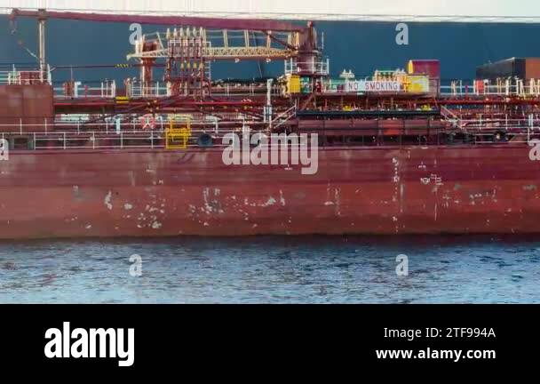 Large ship with NO SMOKING sign is entering a city port real time Stock ...