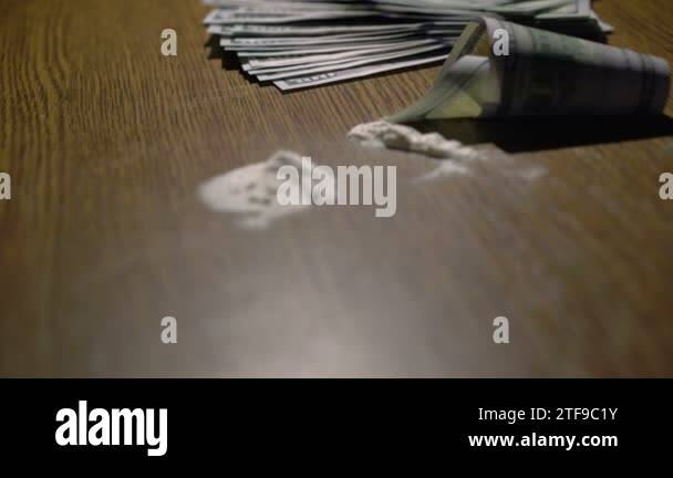 Cocaine snorted on a mirror through rolled 100 dollar bank note, 4k ...
