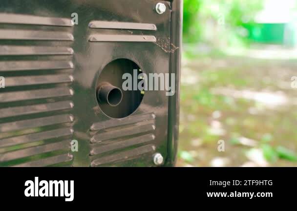 The exhaust pipe of the gas generator during engine start close-up ...