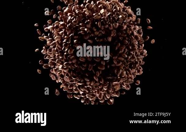 Super slow motion of rotating coffee beans, macro shot. Ultimate composition and motion. Filmed ...