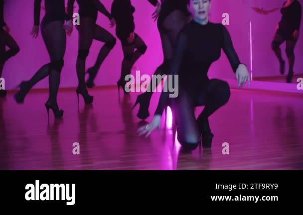 A woman dancer walks forwards and lying down on the floor with dance ...