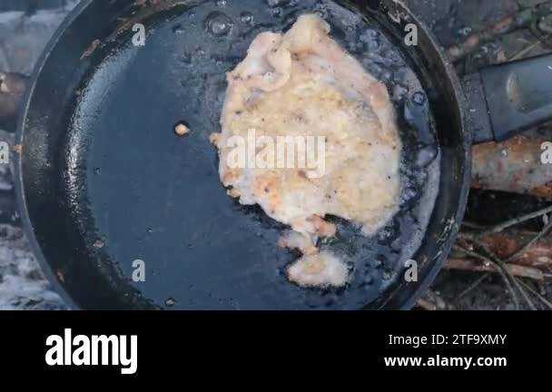Fried Pork Chops in Oil in a Frying Pan over Fire Outdoor, Cooking ...