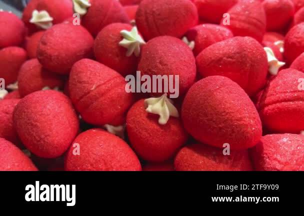strawberry jelly sweets on the counter are laid out all the colors of ...